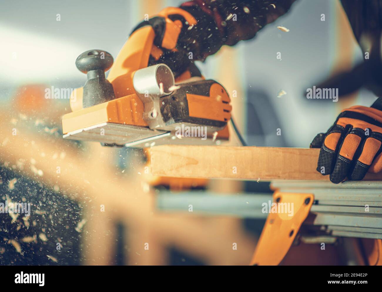 Caucasian Carpenter with Corded Wood Planer in His Hand Planing Wood ...
