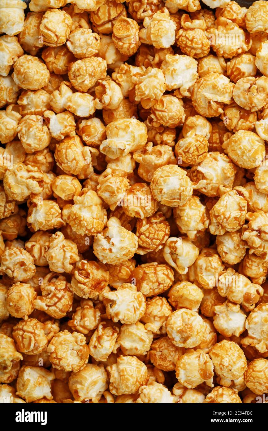 Caramel popcorn close-up as a background, full-screen texture ...