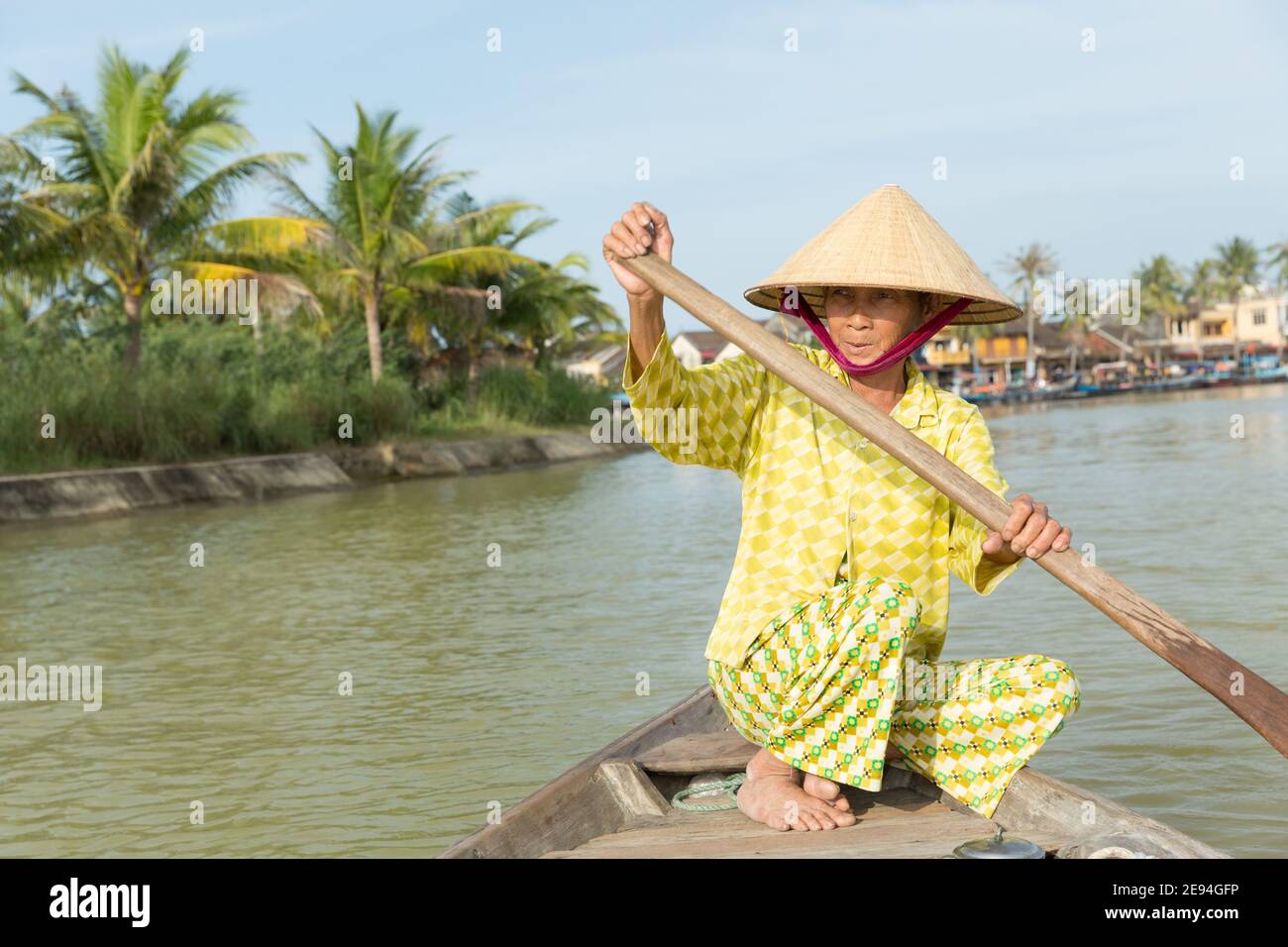 Vietnam Hoi An Old woman rowing canoe Stock Photo - Alamy