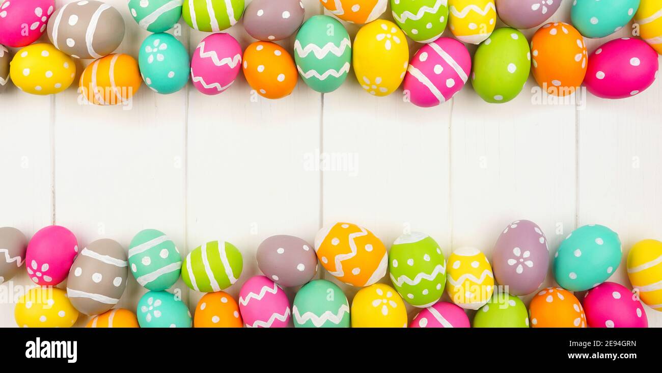Colorful Easter banner with double border of Easter Eggs against a ...