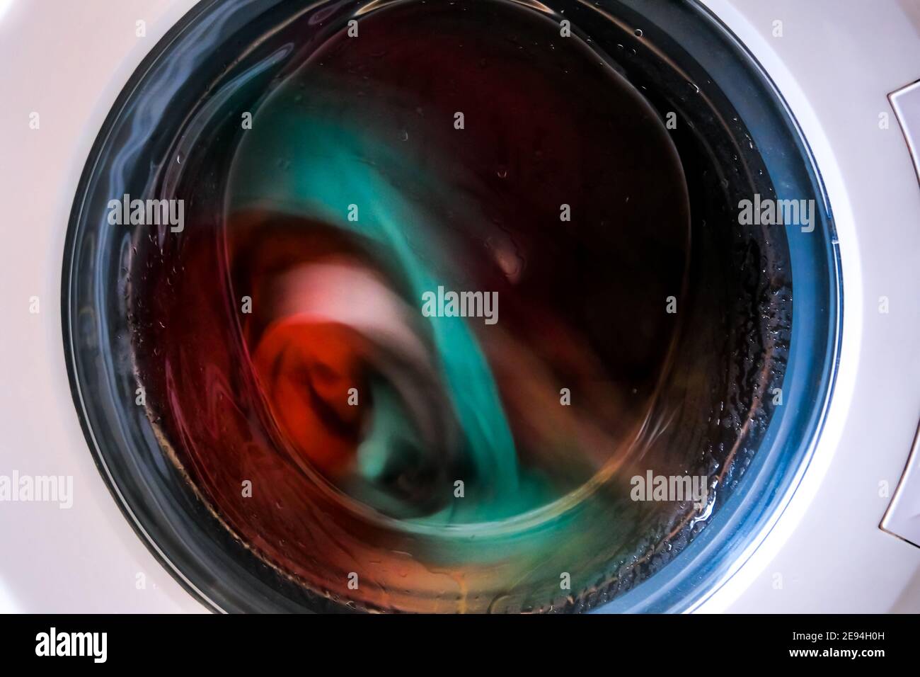 washing machine with dirty clothes inside Stock Photo - Alamy