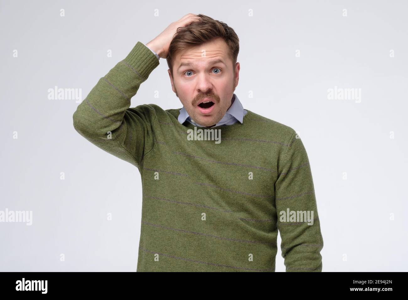 Caucasian man thinking trying to remember something, confused, looking ...