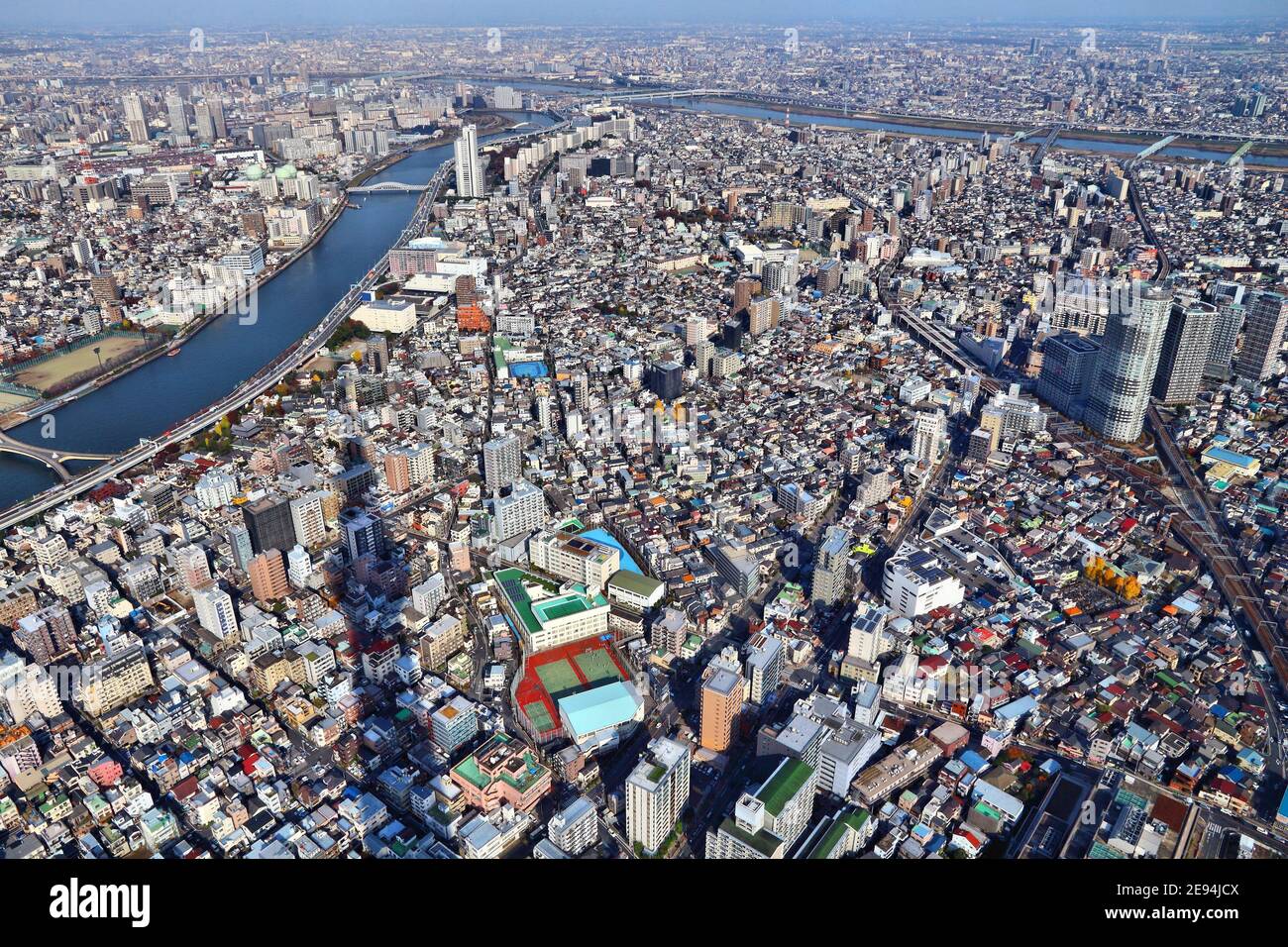 Tokyo city aerial view with shadow of a tall building. Sumida river ...