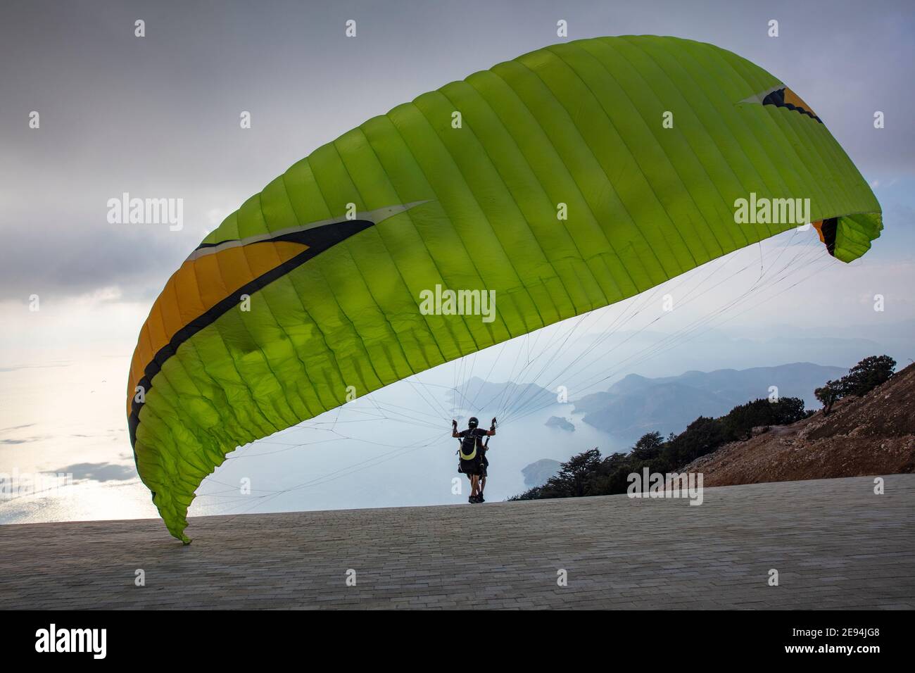 Paragliding in the sky. Paraglider tandem flying over the sea with ...