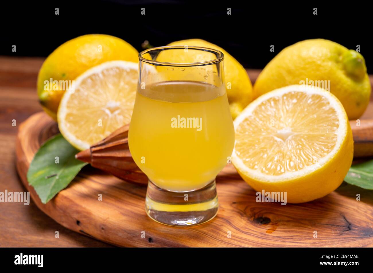 Glass of ice cold sweet limoncello liqueur made from new harvest of ...