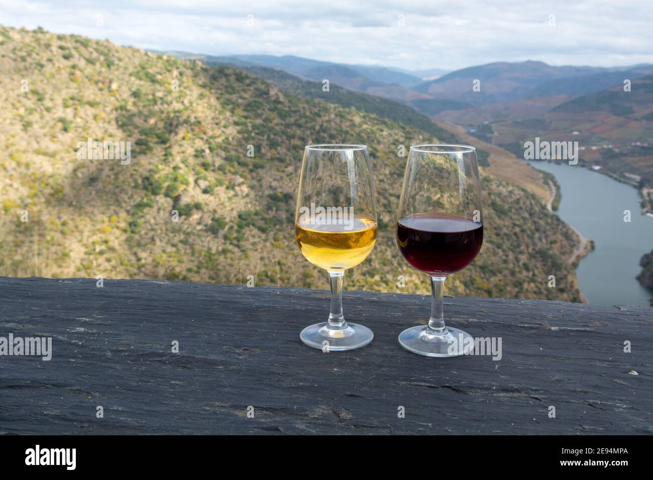 Glasses of Portuguese fortified white and red port wine, produced in ...