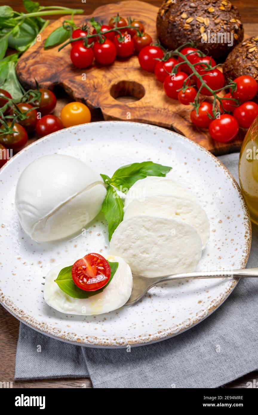 Cheese collection, eating of white soft Italian cheese mozzarella ...