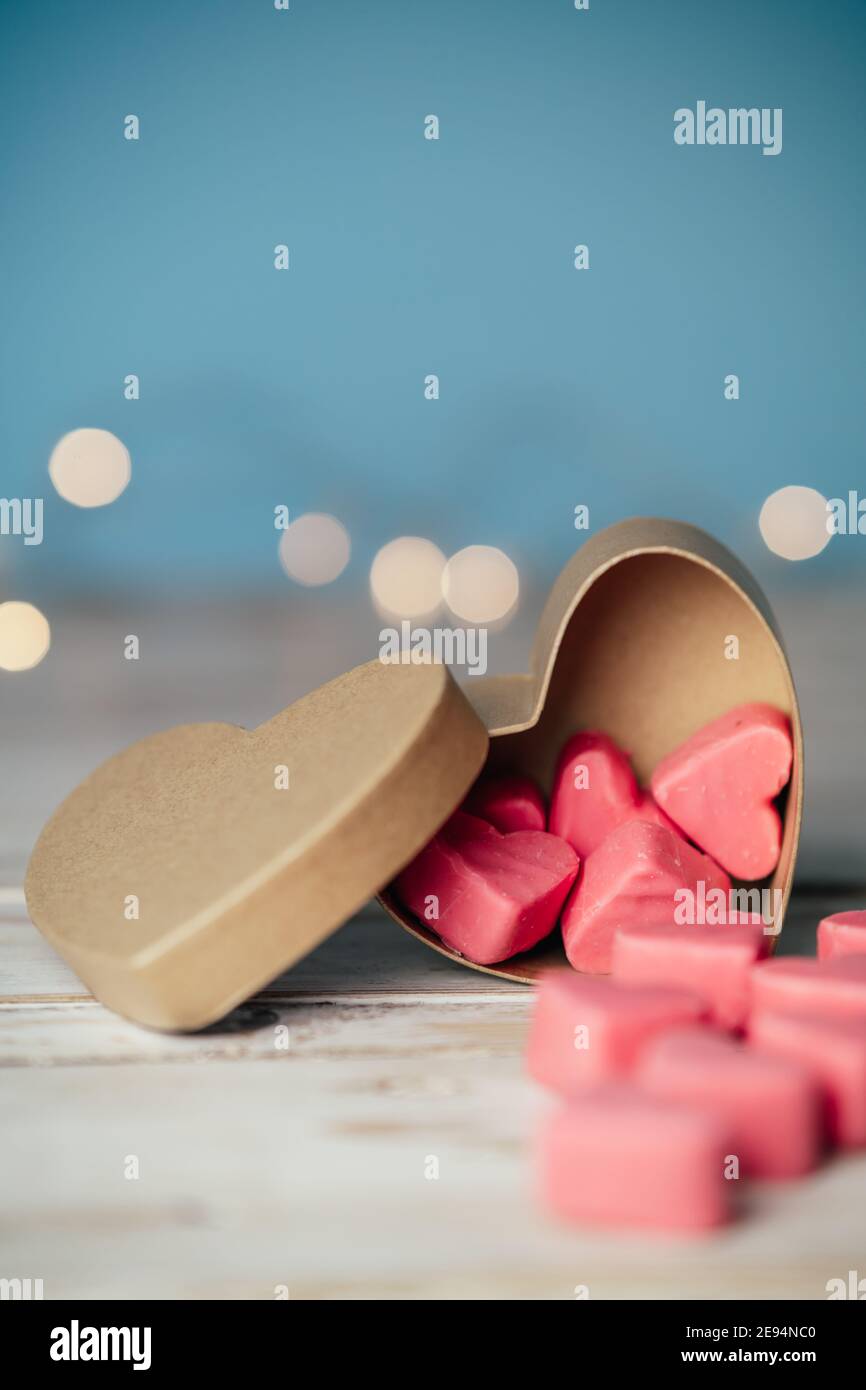Valentines day pink hearts on white table with blue background-3 Stock ...