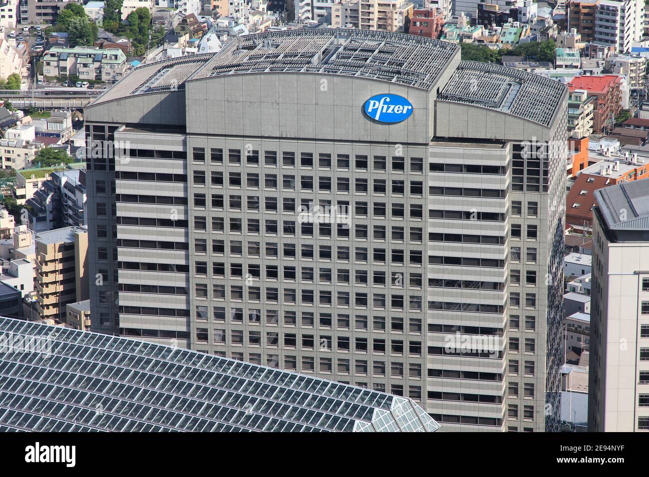 TOKYO, JAPAN - MAY 11, 2012: Pfizer building in Tokyo. Pfizer is one of ...