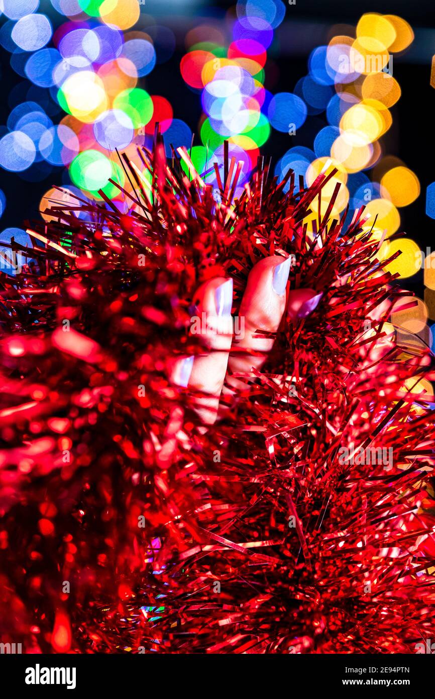 Holding Christmas garland decoration isolated on background with ...