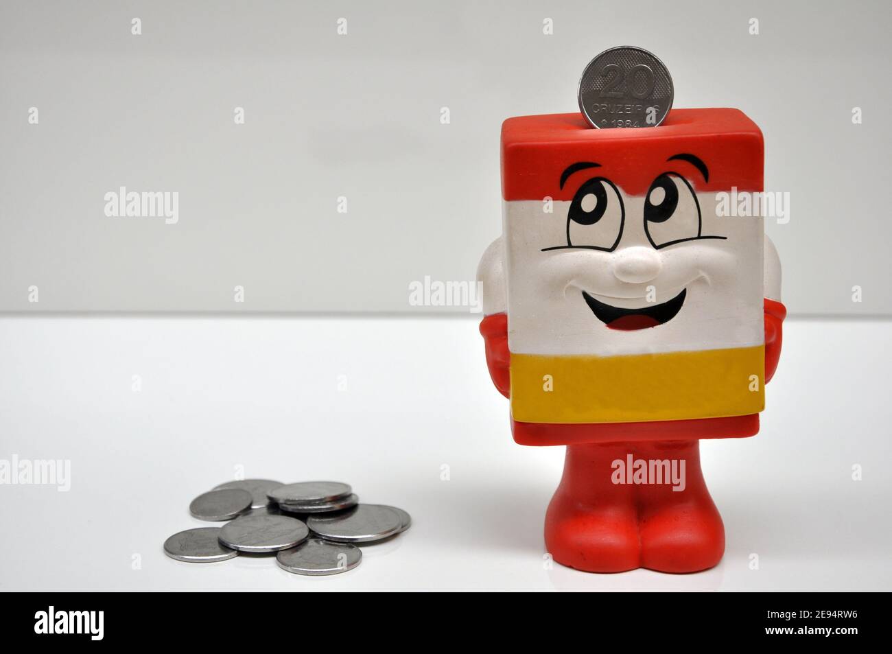 Mascot style vinyl doll with coins for children to save coins and money ...