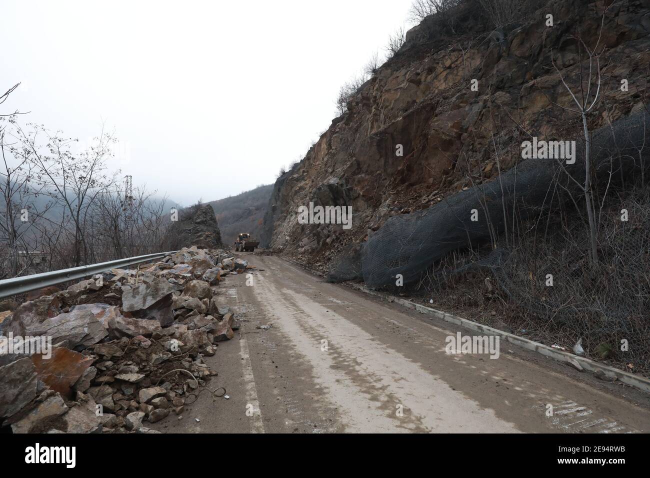 Heavy chain and wheeled equipment clears the highway after a rock ...