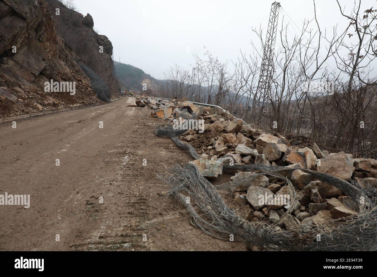 Heavy chain and wheeled equipment clears the highway after a rock ...