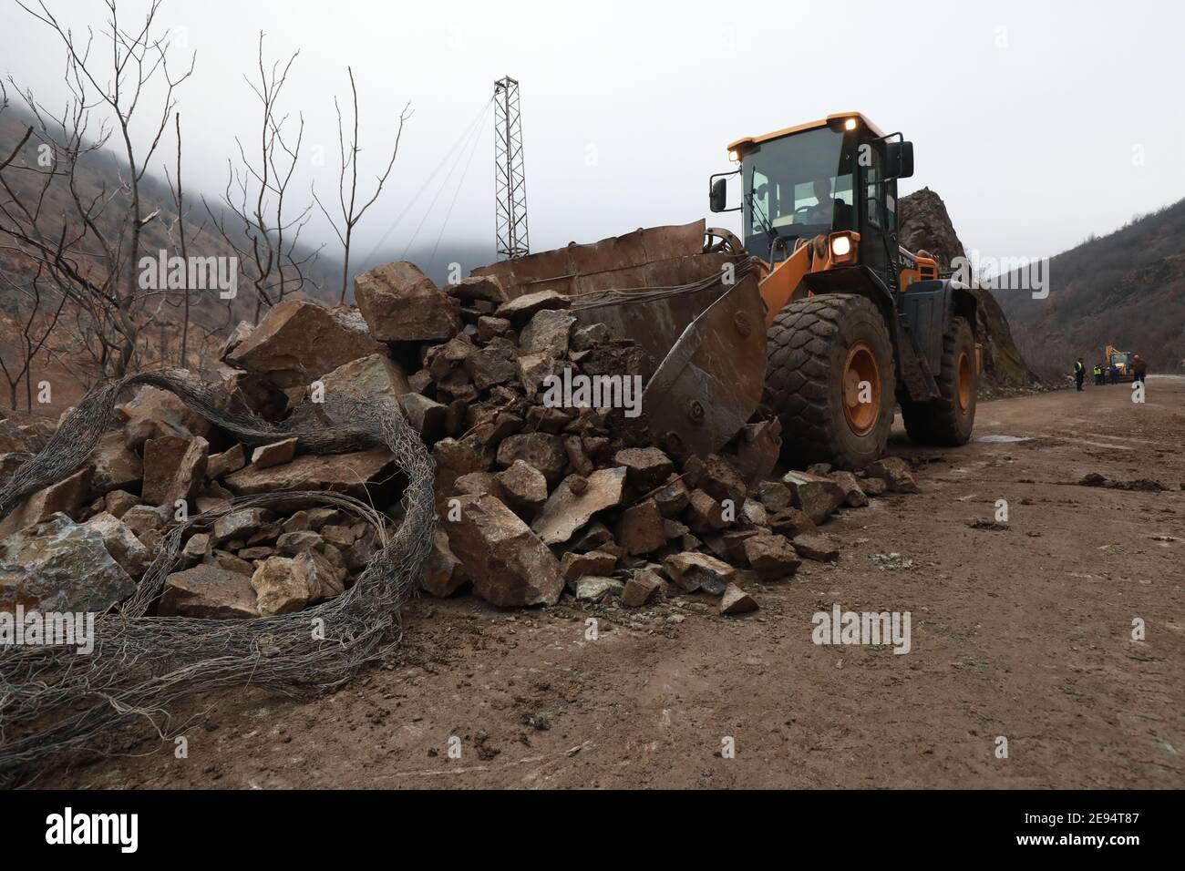 Heavy chain and wheeled equipment clears the highway after a rock ...