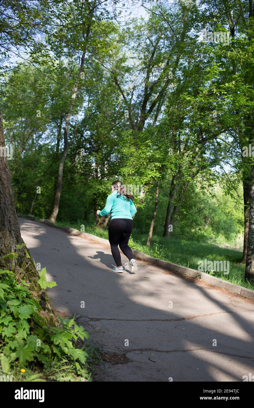 Woman on a morning run in the park. This is a healthy lifestyle Stock ...