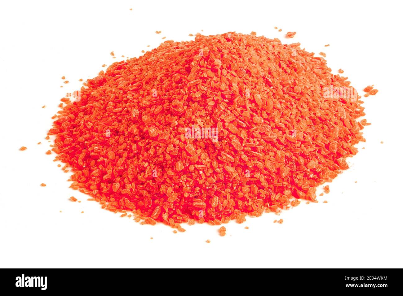 Pile of dry red chemical granules - close-up isolated on white ...