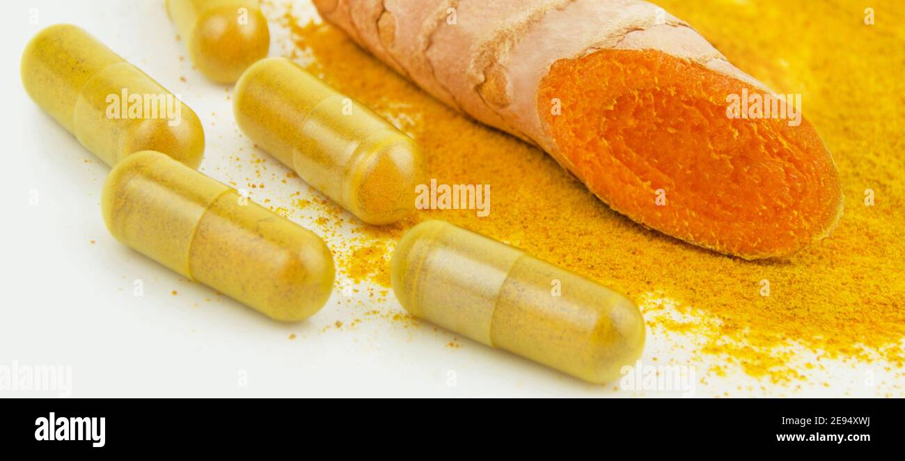 Curcuma capsules and powder with root Stock Photo - Alamy