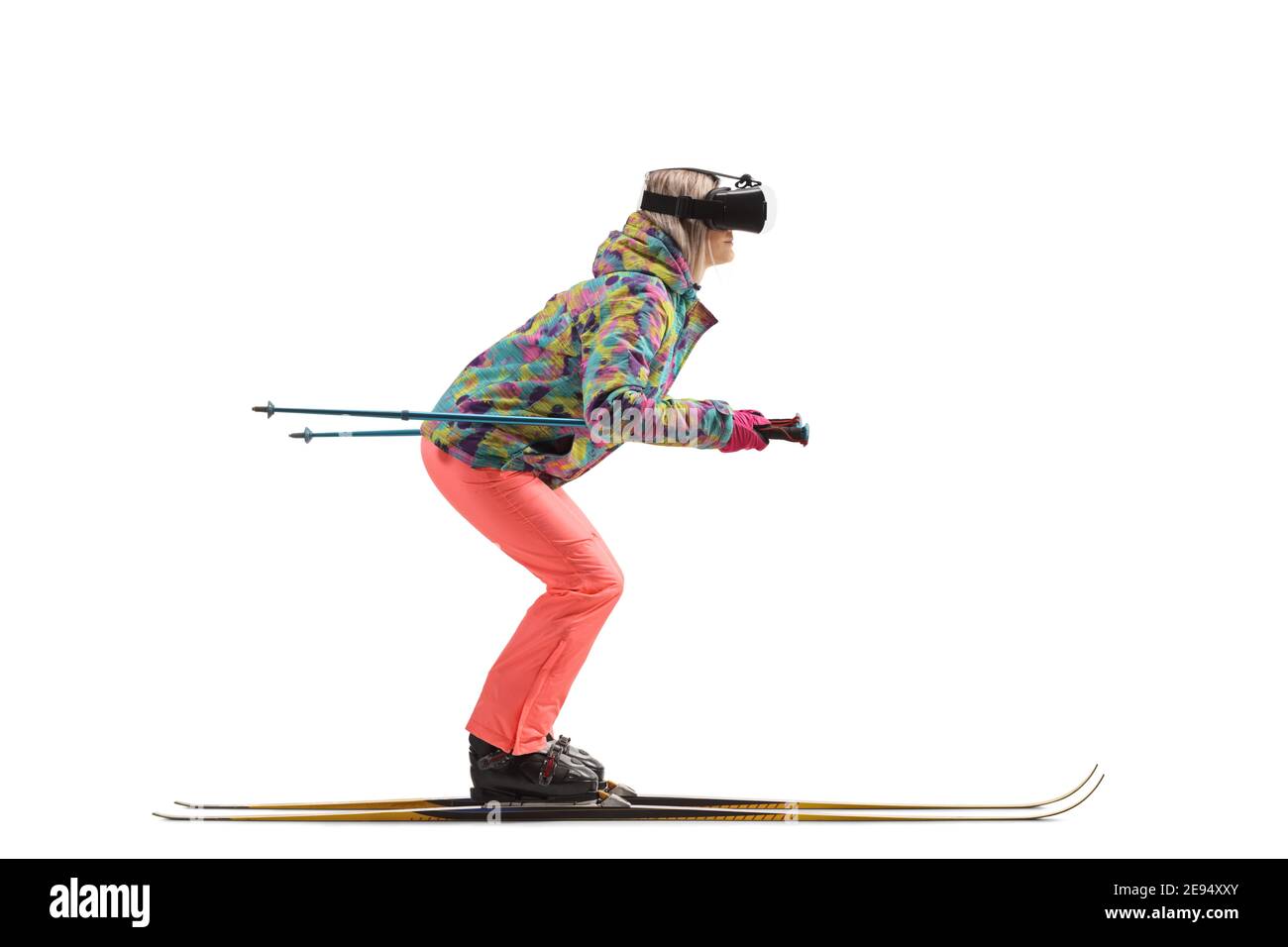 Full length profile shot of a female skiing isolated on a white ...