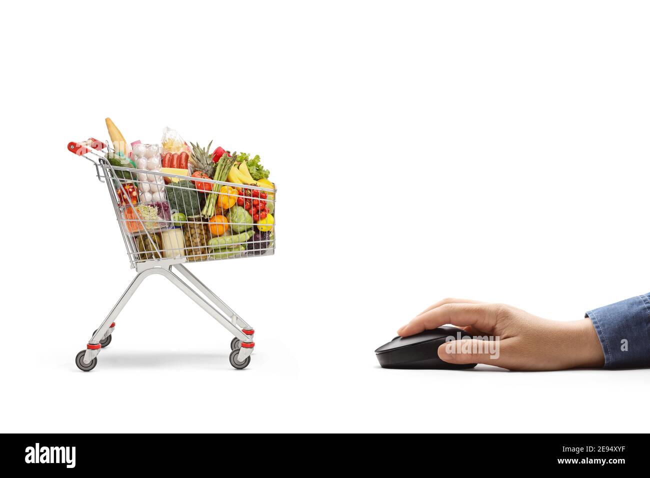 Hand clicking on a computer mouse for online groceries shopping with a ...