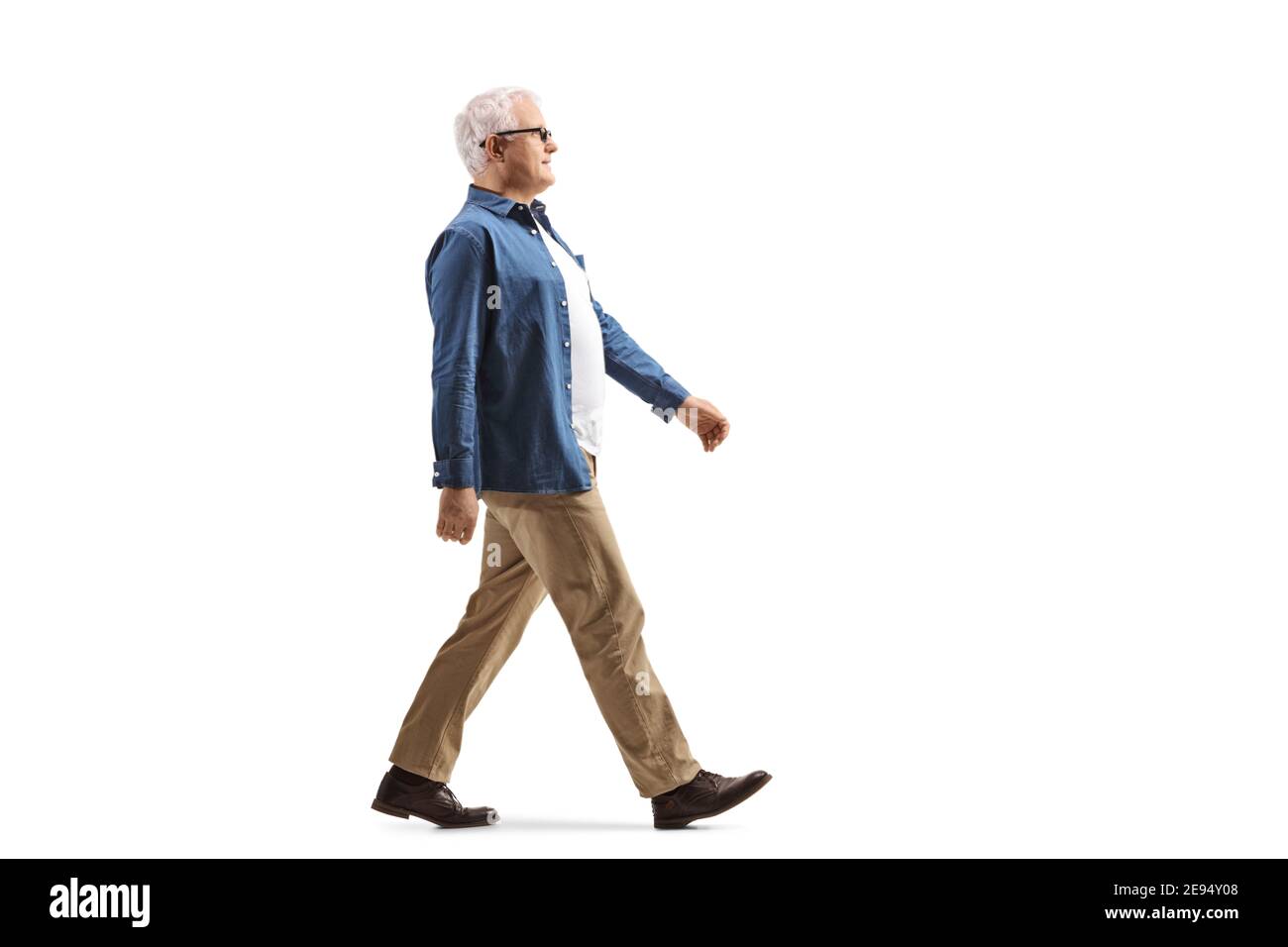 Full length profile shot of a casual mature man walking isolated on ...