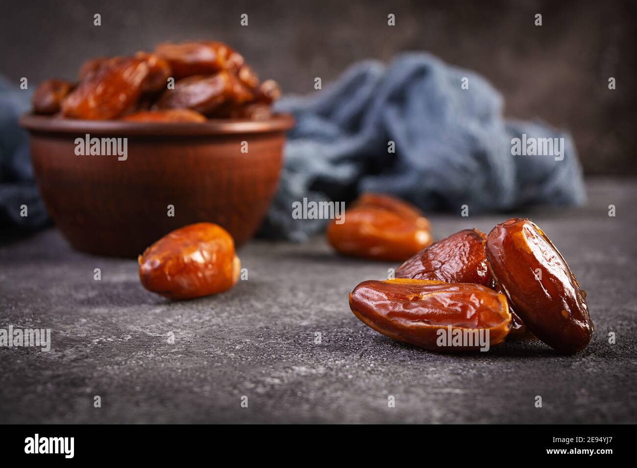 Dried date fruit in bowl on wooden background. Delicious dates fruit ...