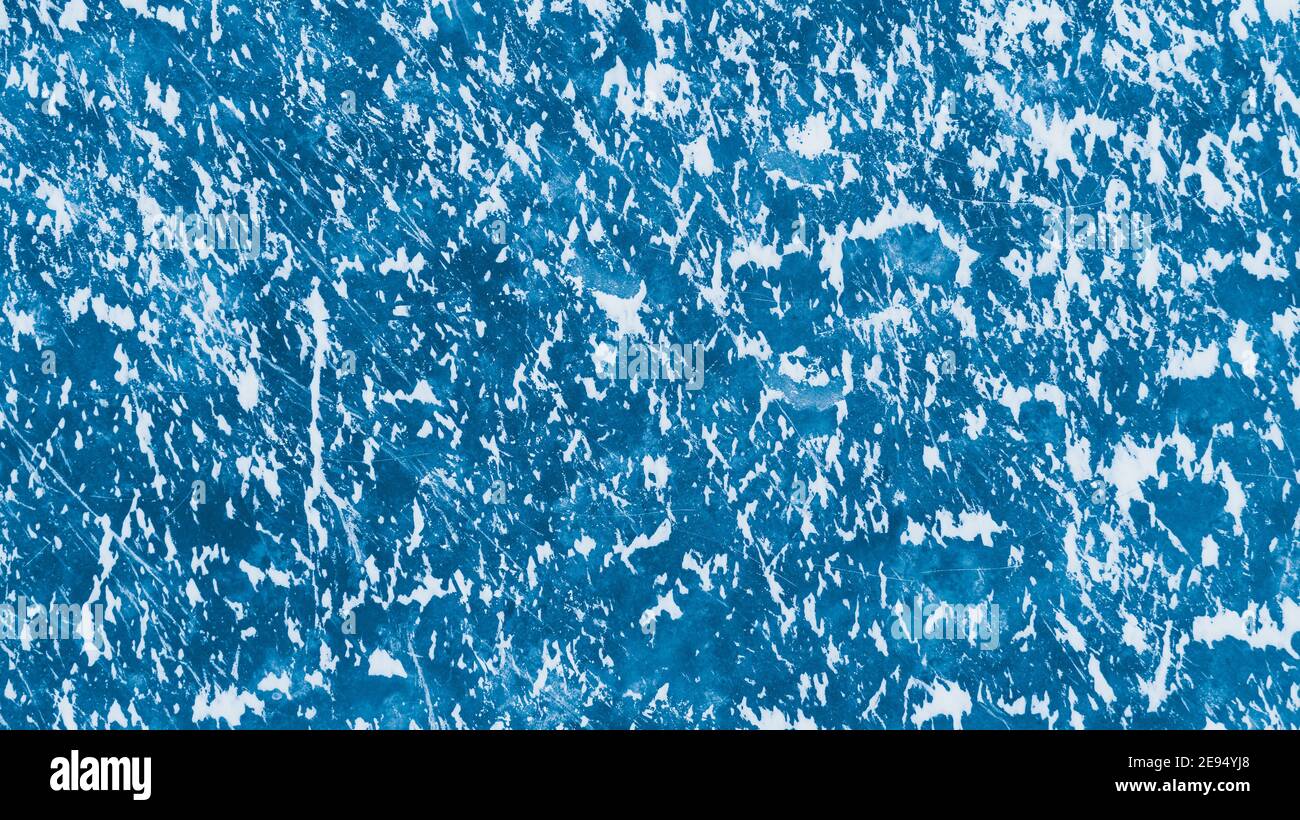 Blue ice surface with scratches and snow Stock Photo - Alamy