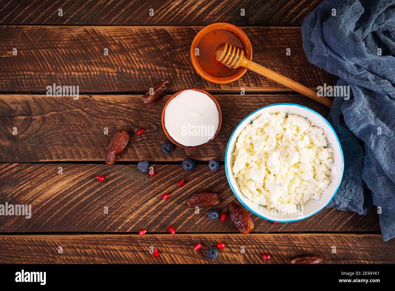 Cottage cheese with honey and berries on wooden background. Light ...