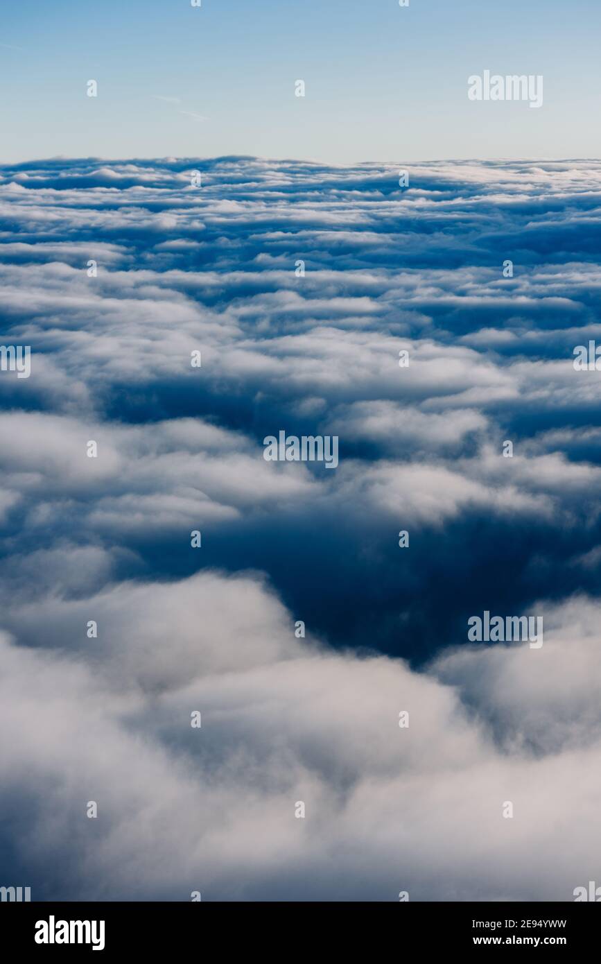 Vertical shot of clouds in the bright sky - perfect for background ...
