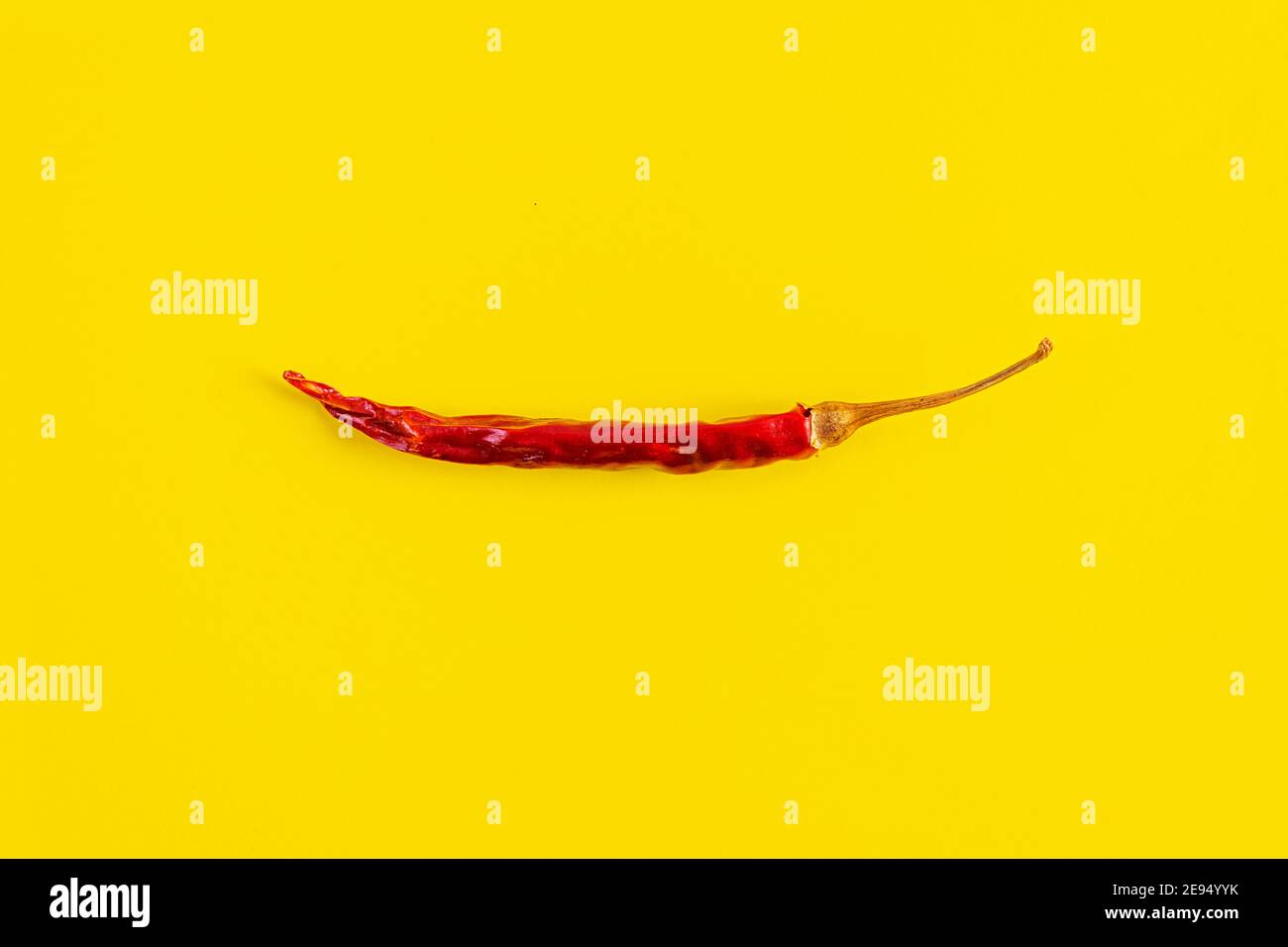 Dried red chili pepper on yellow background. Texture of isolated chili ...