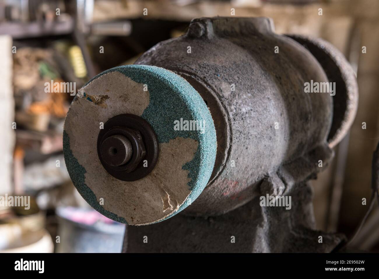 Bench grinder. The image is taken in a rustic shop of a self-employed ...