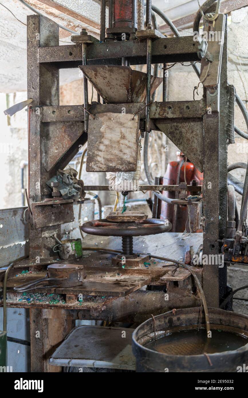 Rustic homemade machines for melting plastic and injecting the liquid ...