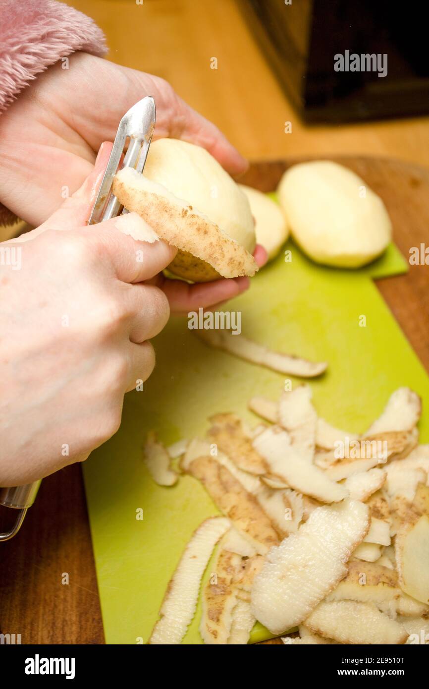 Woman cutting potato hi-res stock photography and images - Alamy
