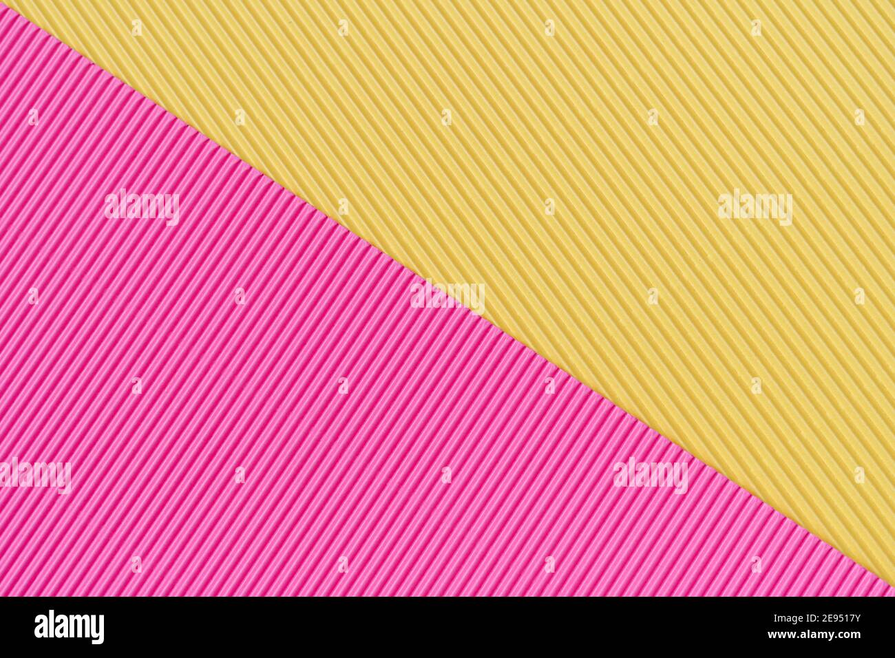Yellow and pink two tone color paper background with stripes. Abstract ...