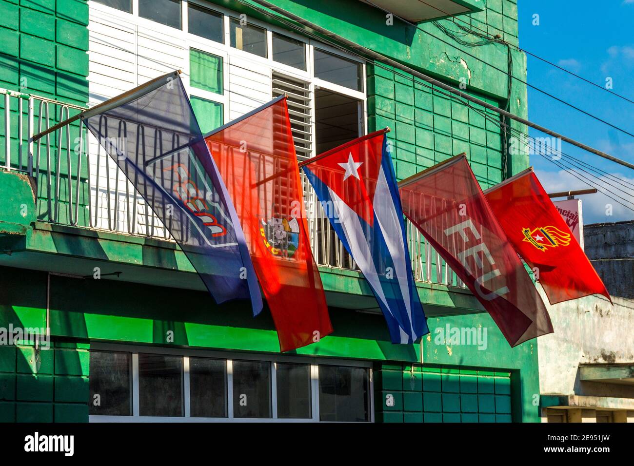 Flags of diverse student organizations and the Cuban flag is seen in ...