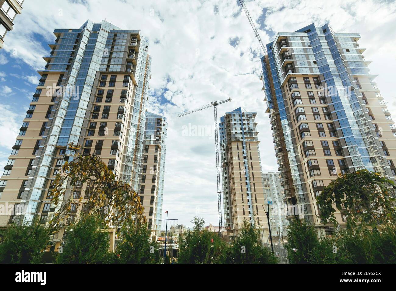 luxury residential high-rise buildings with mirrored glazing are under ...