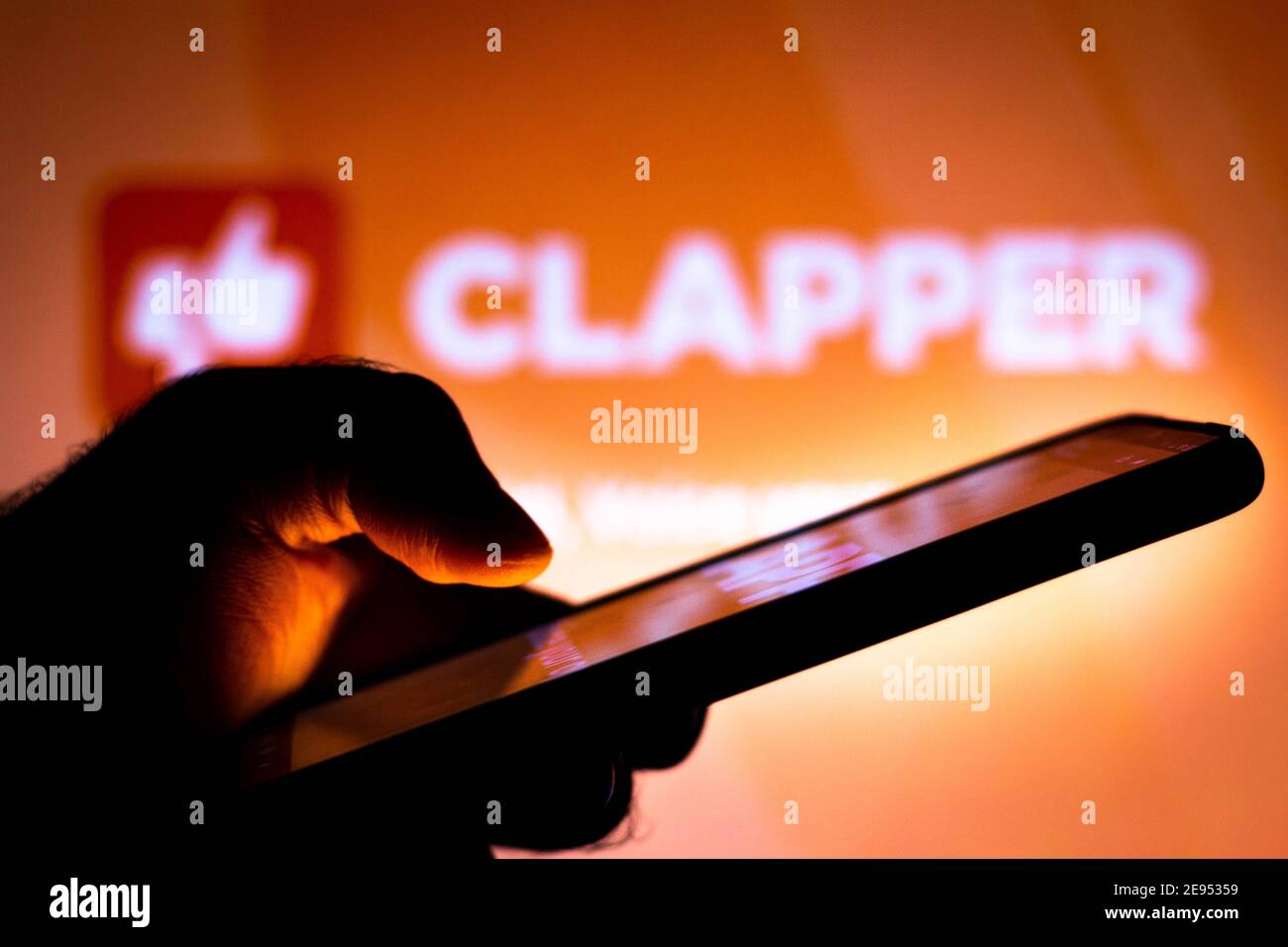 In this photo illustration the Clapper logo seen in the background of a ...