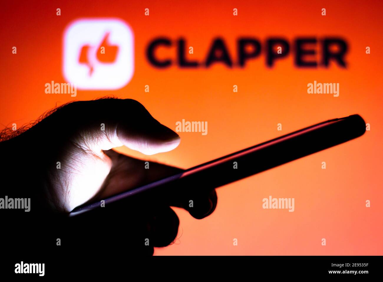 In this photo illustration the Clapper logo seen in the background of a ...