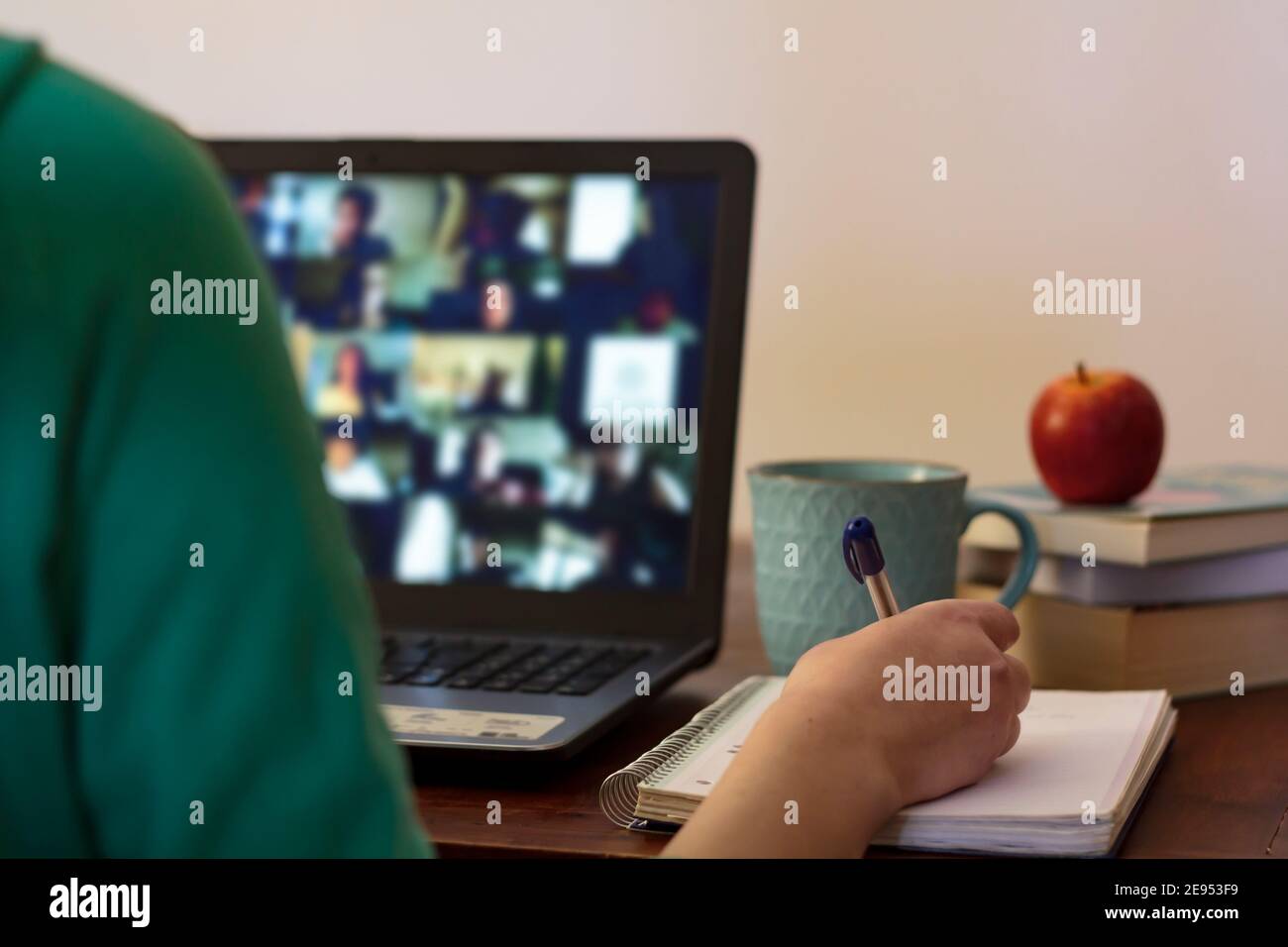 Student taking notes at online class. Concept of E-learning Stock Photo ...