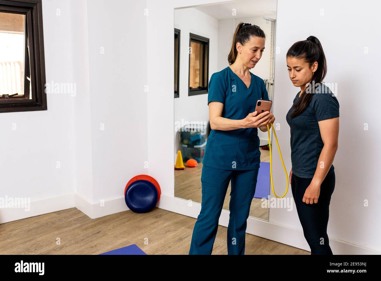 Stock photo of a female clinic worker explaining something with the ...