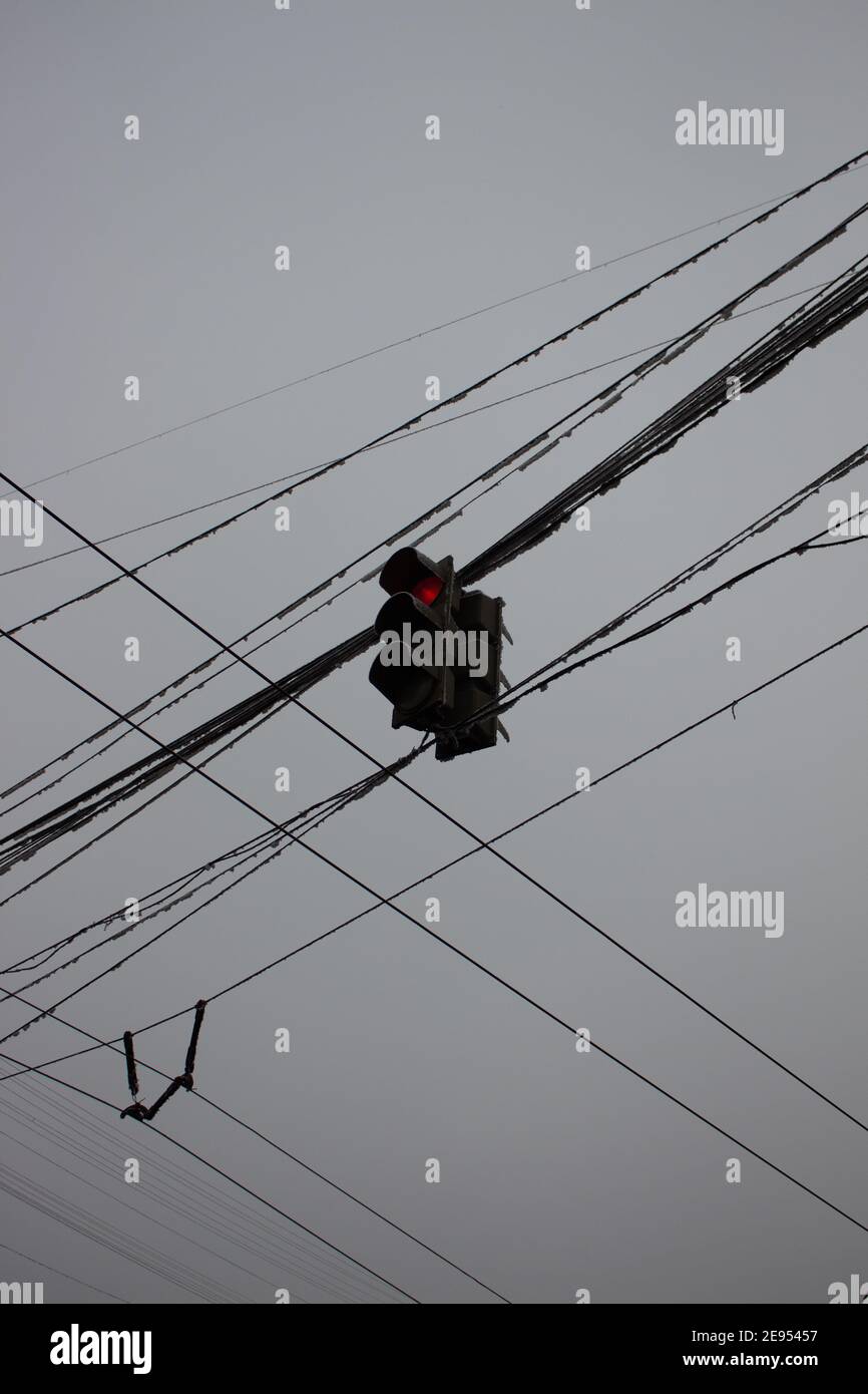 Traffic light hanging on wires hi-res stock photography and images - Alamy