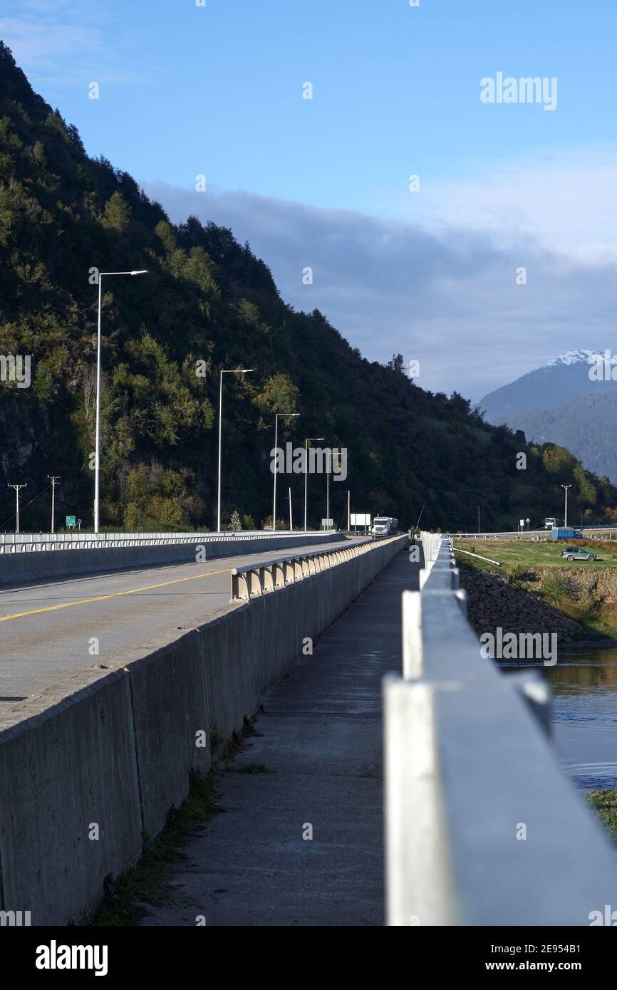 Narrow sidewalk of a bridge over a river in the countryside Stock Photo ...