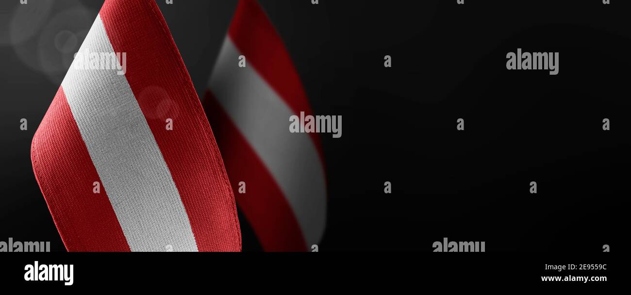 Small national flags of the Austria on a dark background Stock Photo ...