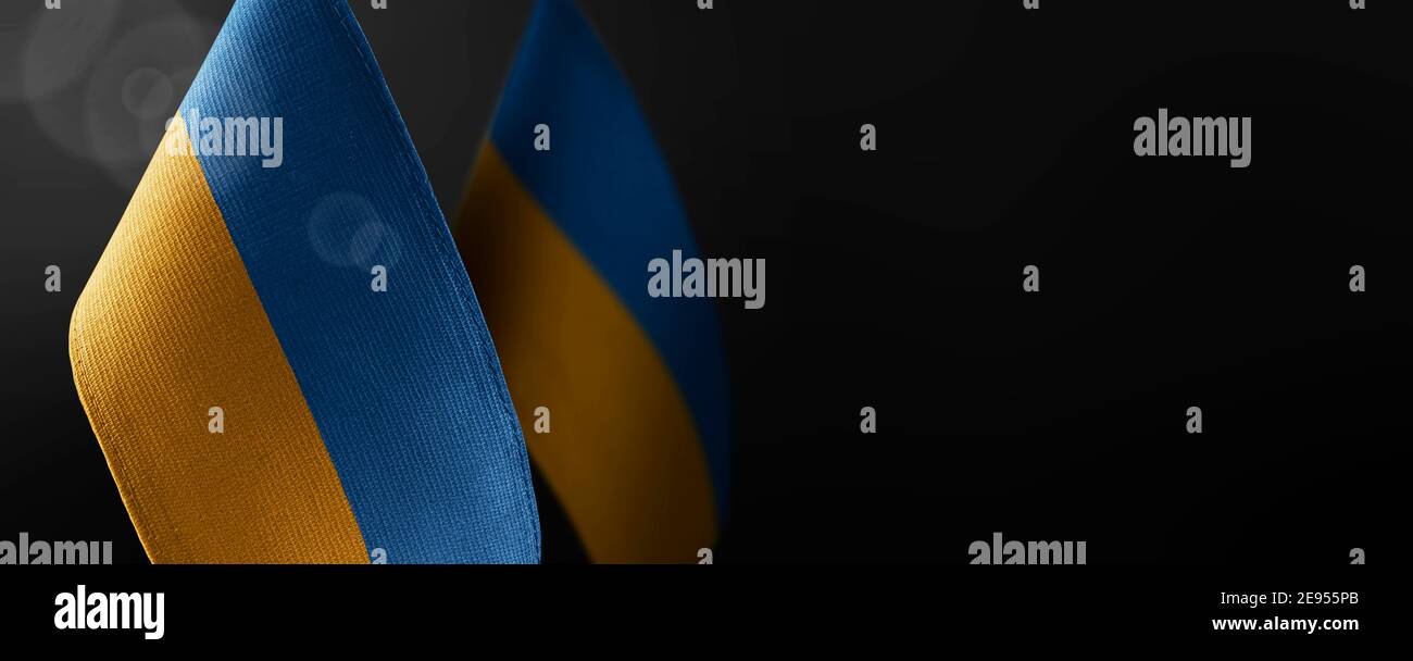 Small national flags of the Ukraine on a dark background Stock Photo ...