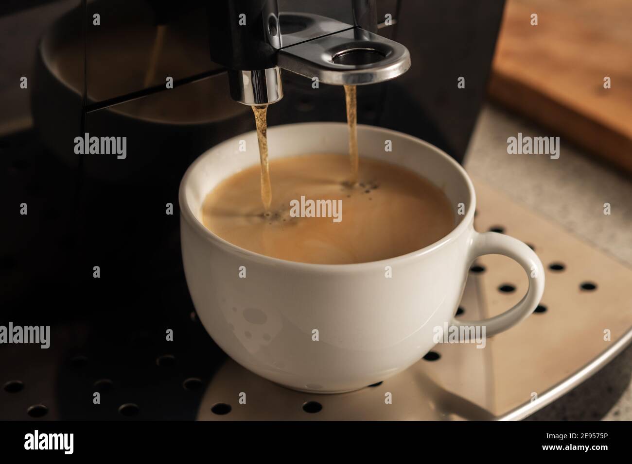 Modern espresso coffee machine with a cup closeup Stock Photo - Alamy