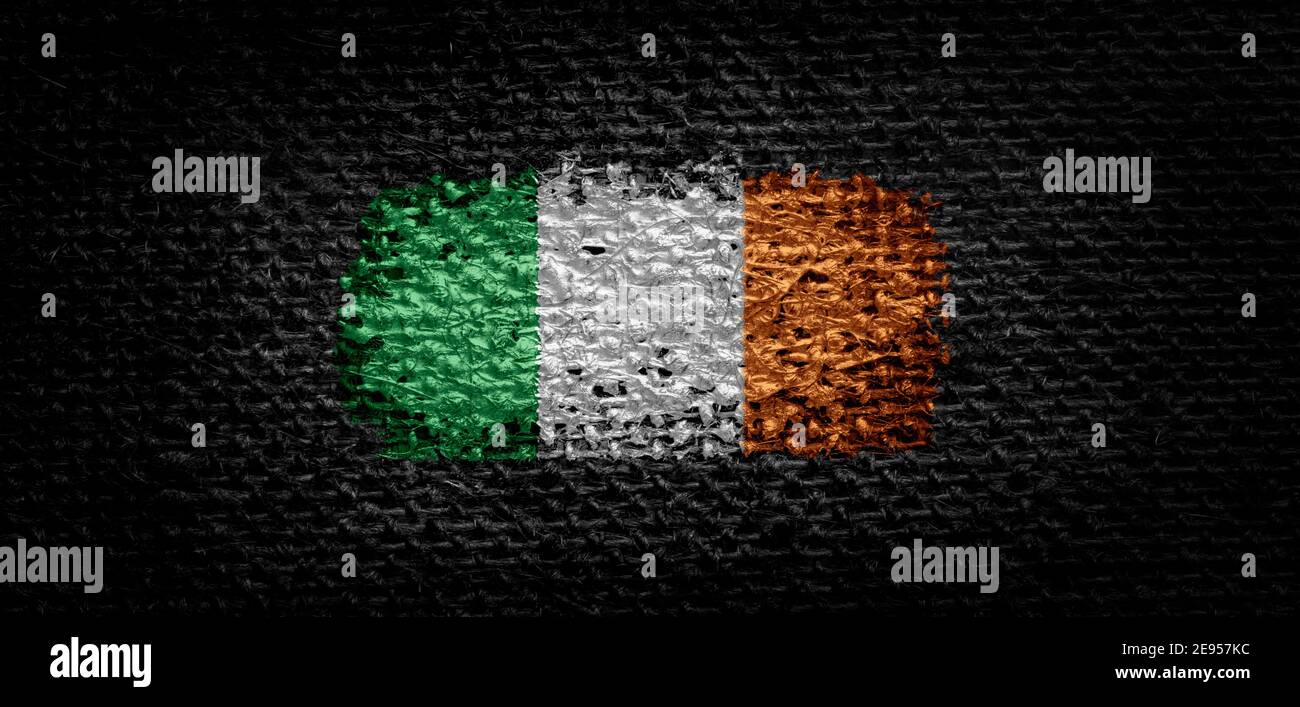 National flag of the Ireland on dark fabric Stock Photo - Alamy