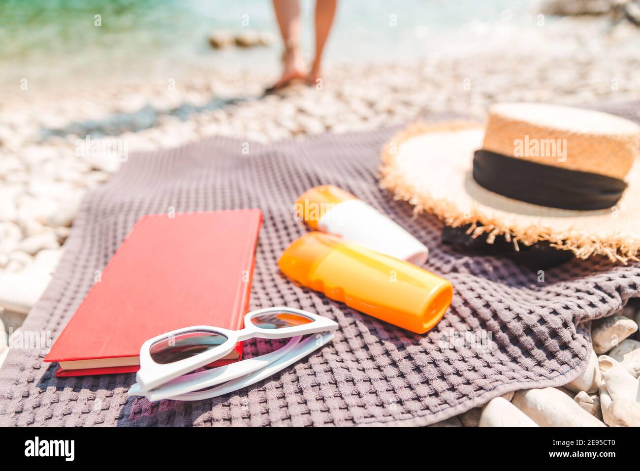 sea stuff at blanket at rocky beach copy space Stock Photo - Alamy