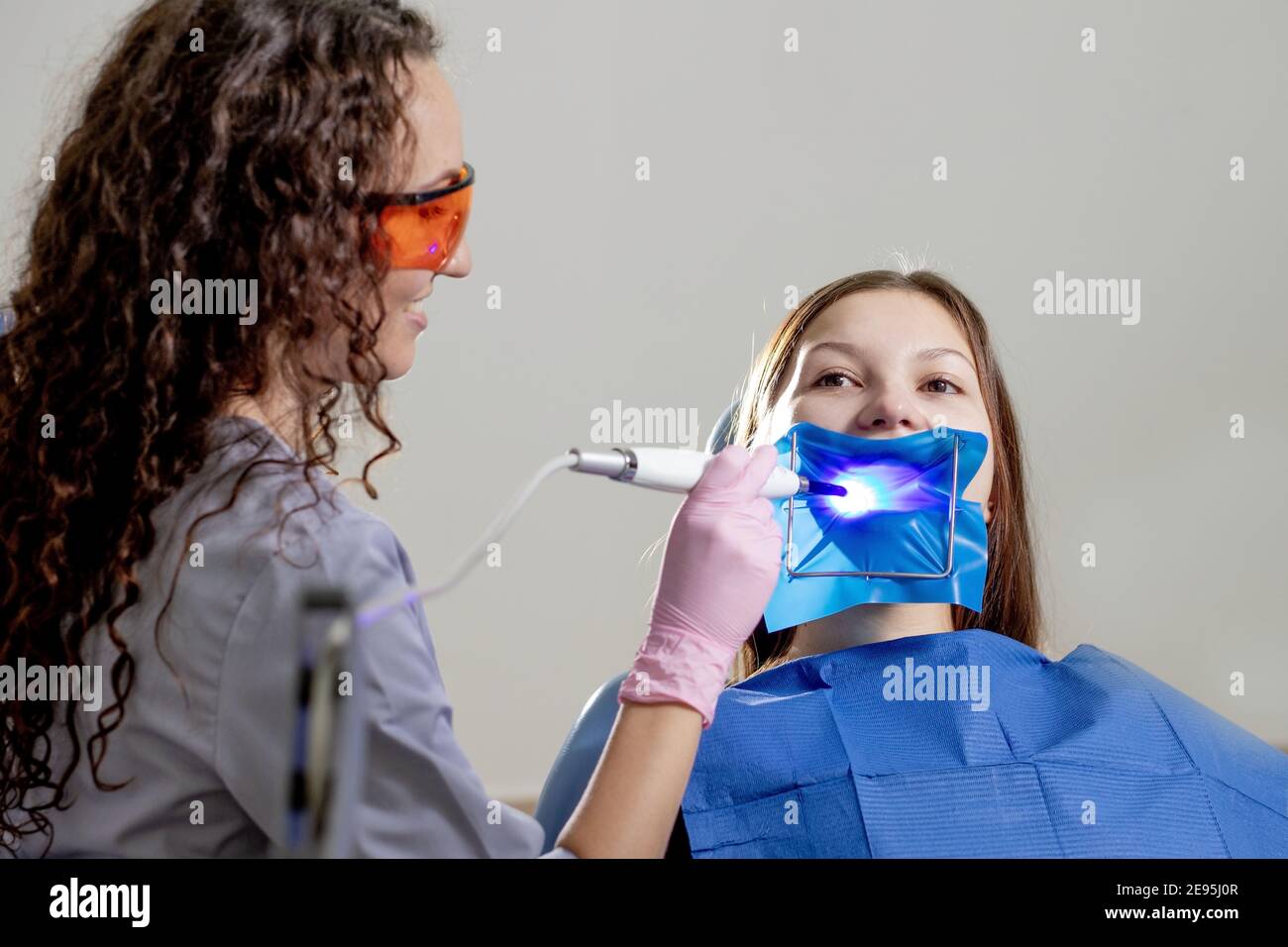 Laser bleaching teeth at dantist room. Teeth whitening for woman ...