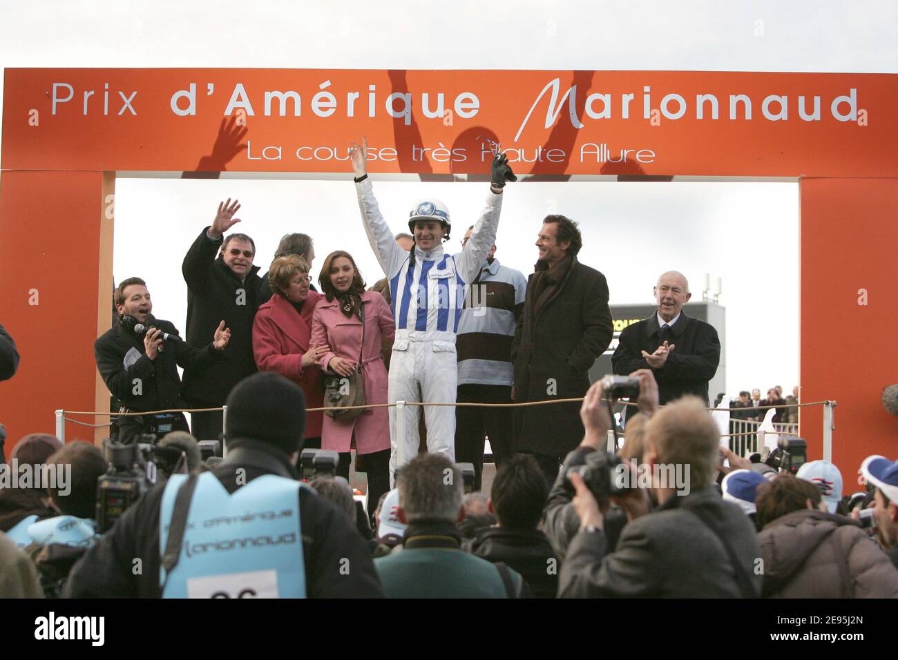 French jockey Christophe Gallier waves to the cheering crowd following ...