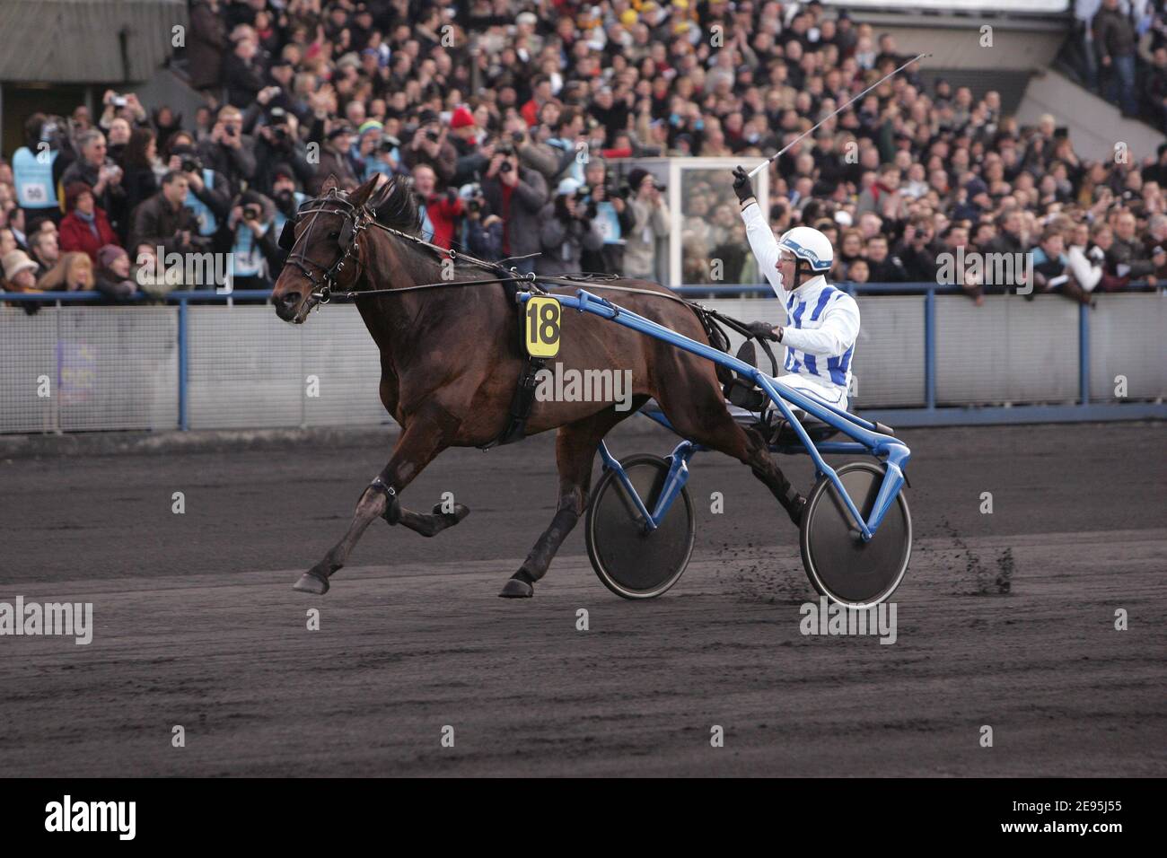 French jockey Christophe Gallier waves to the cheering crowd following ...