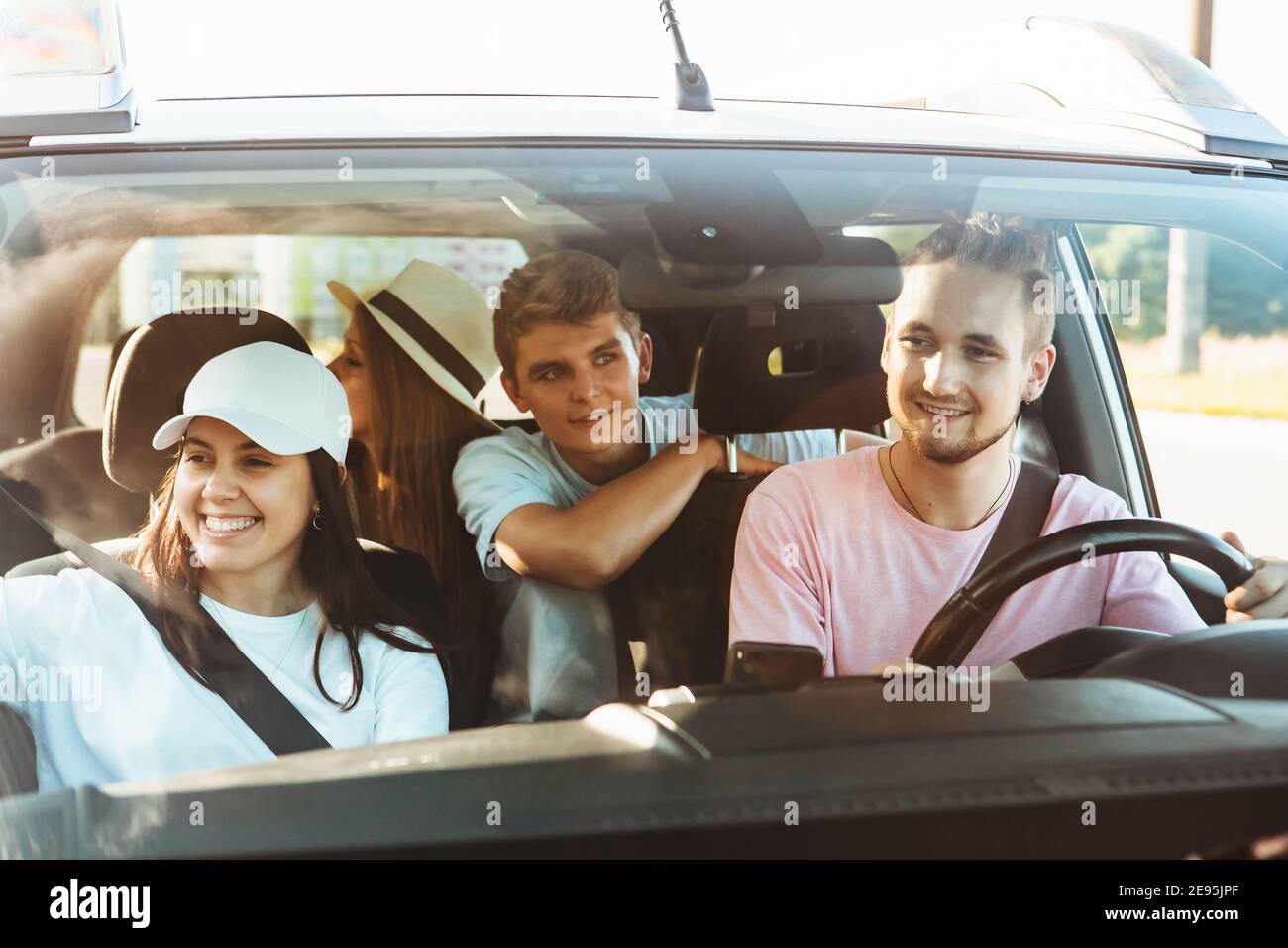 group of friends in car. road trip concept. summer vacation. friendship ...